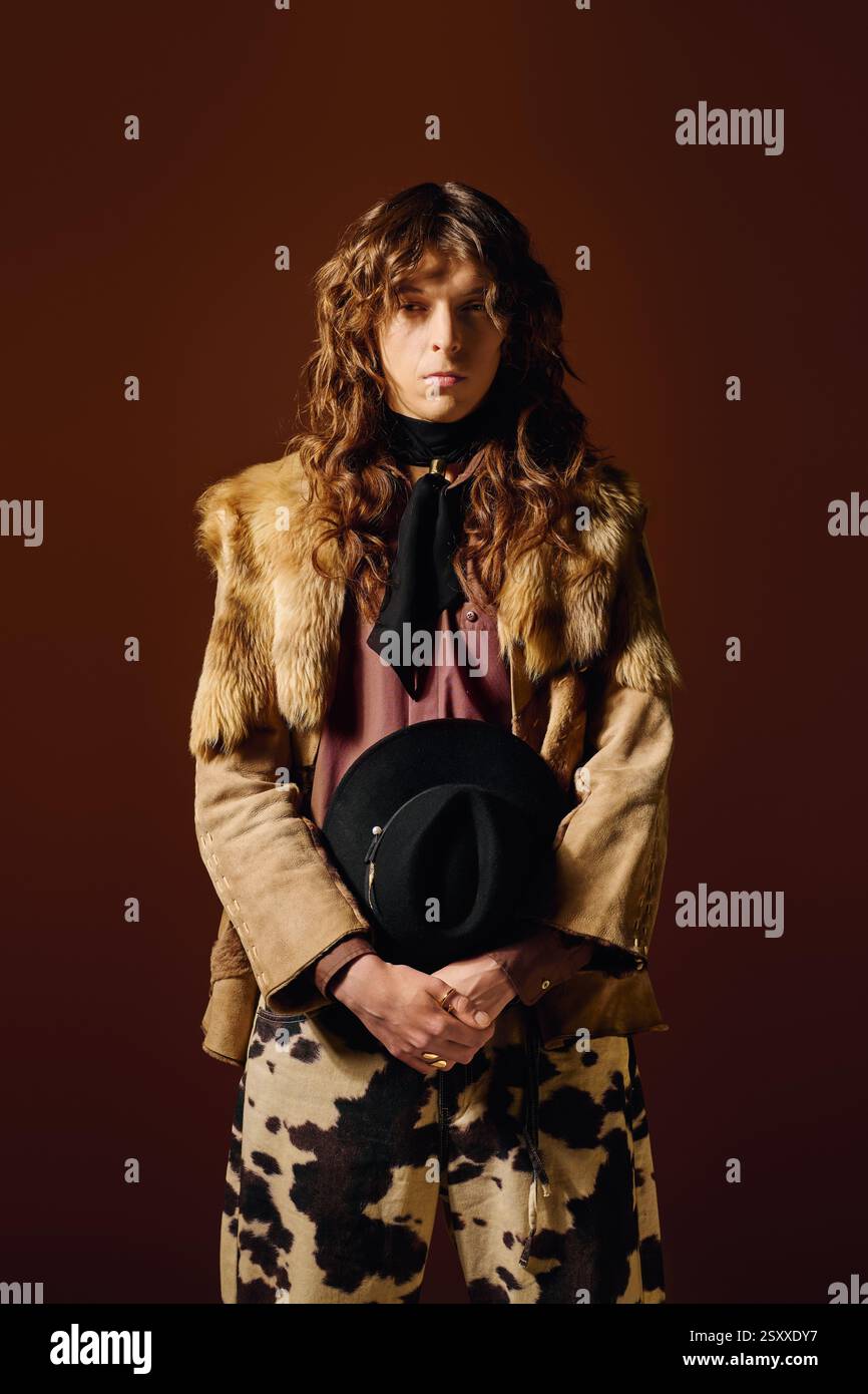 A young man stands with poise, showcasing a blend of fashionable ...