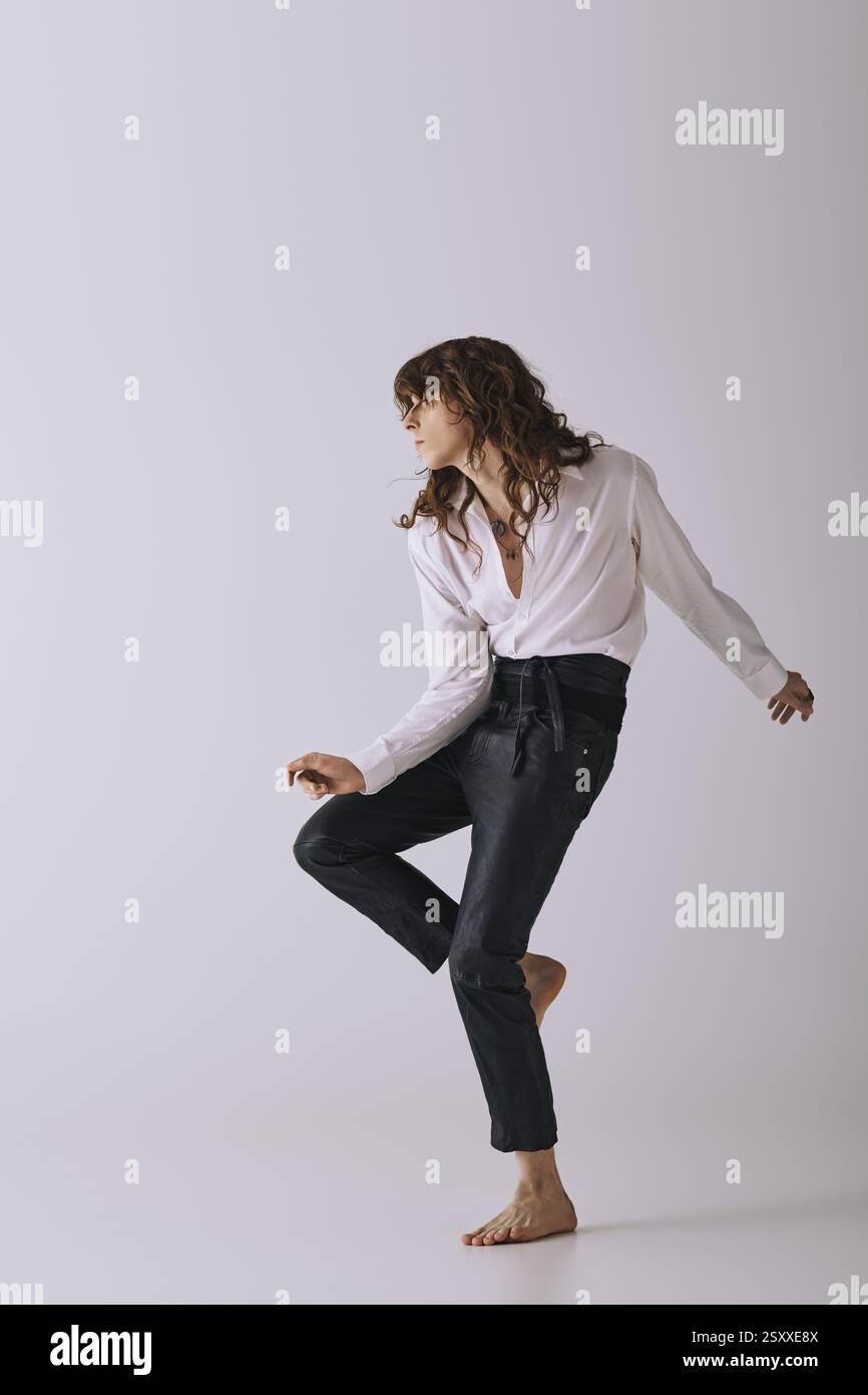 A handsome, young man showcases his fashion sense with a captivating ...