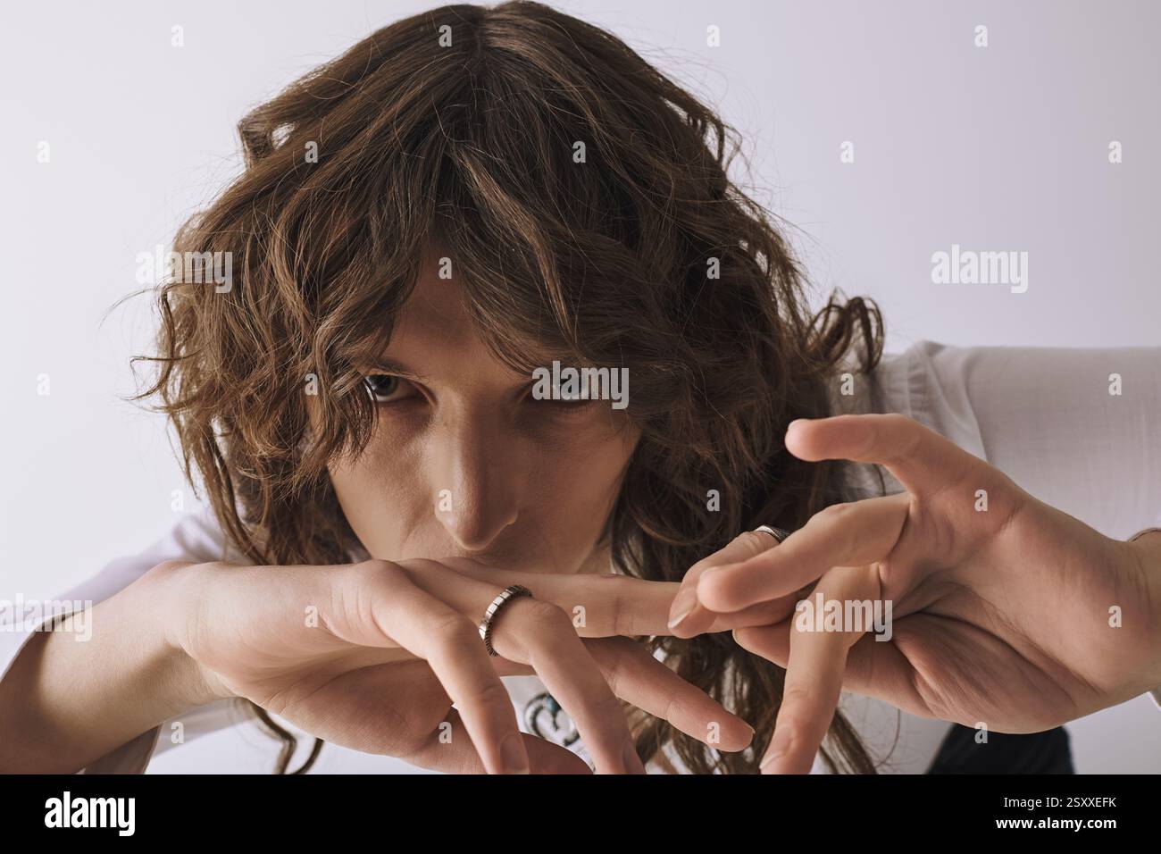 A handsome young man creates an intriguing visual while playing with ...