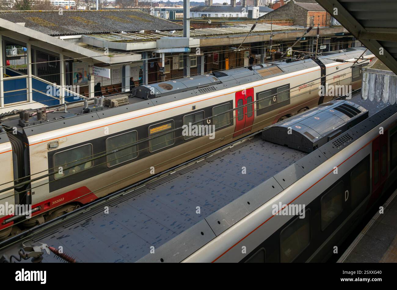 Looking down from above at Greater Anglia trains at platforms of ...