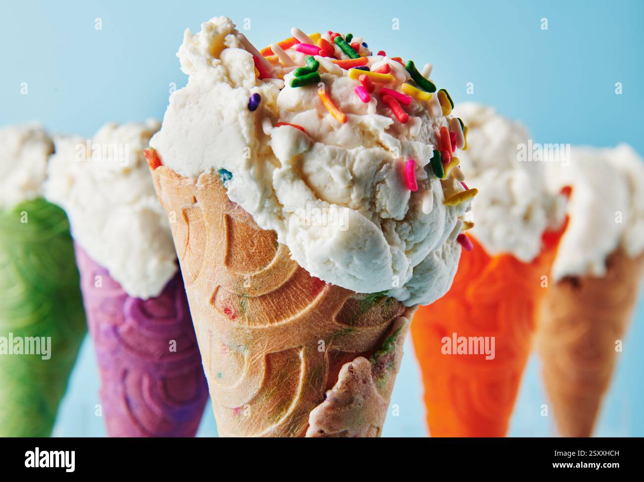 Vanilla ice cream with sprinkles in different colored cones Stock Photo ...