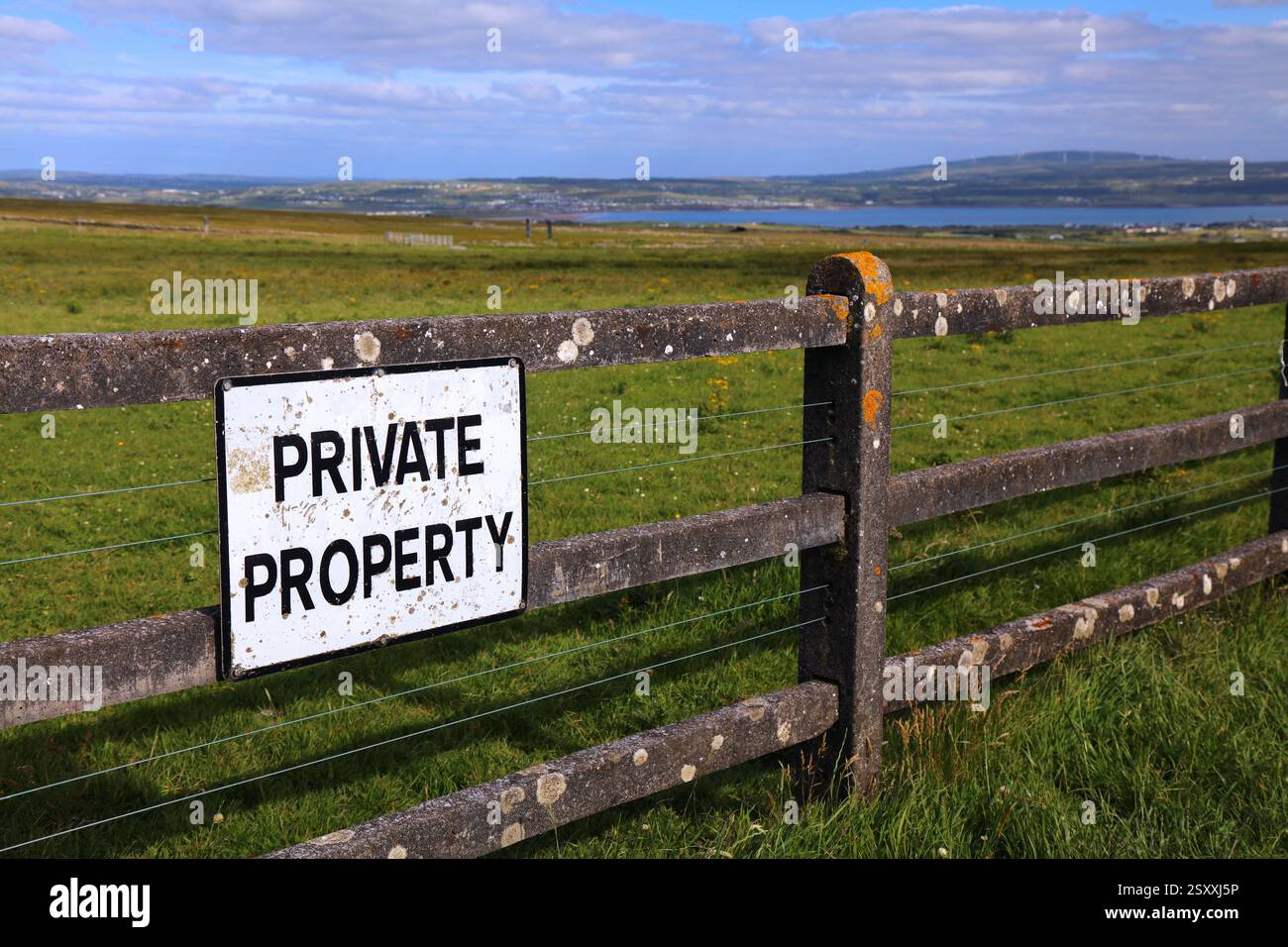 Fence surrounding pastures and agricultural land in County Clare of ...