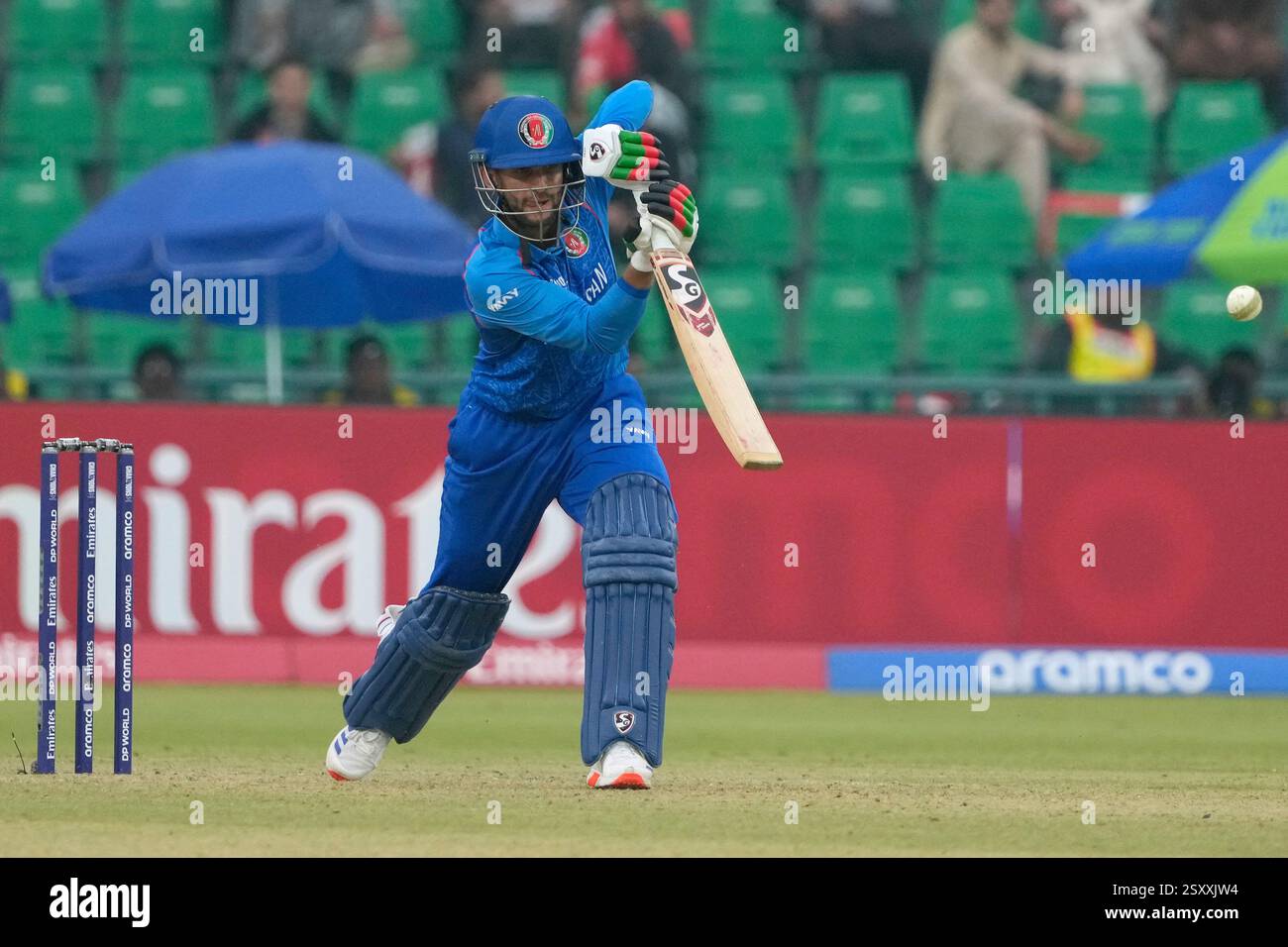 Afghanistan's Azmatullah Omarzai plays a shot during the ICC Champions ...