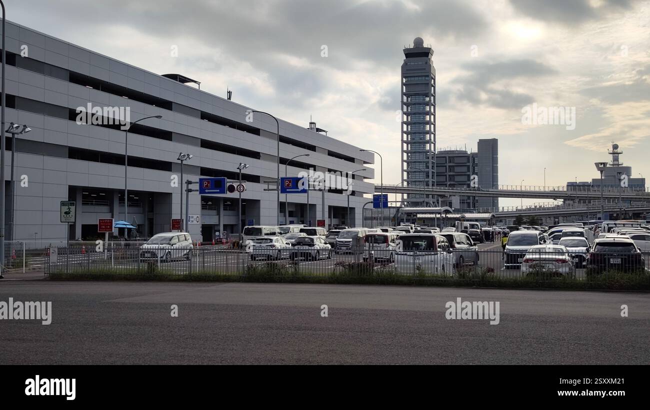 Osaka Kansai International Airport control tower and parking lot at ...