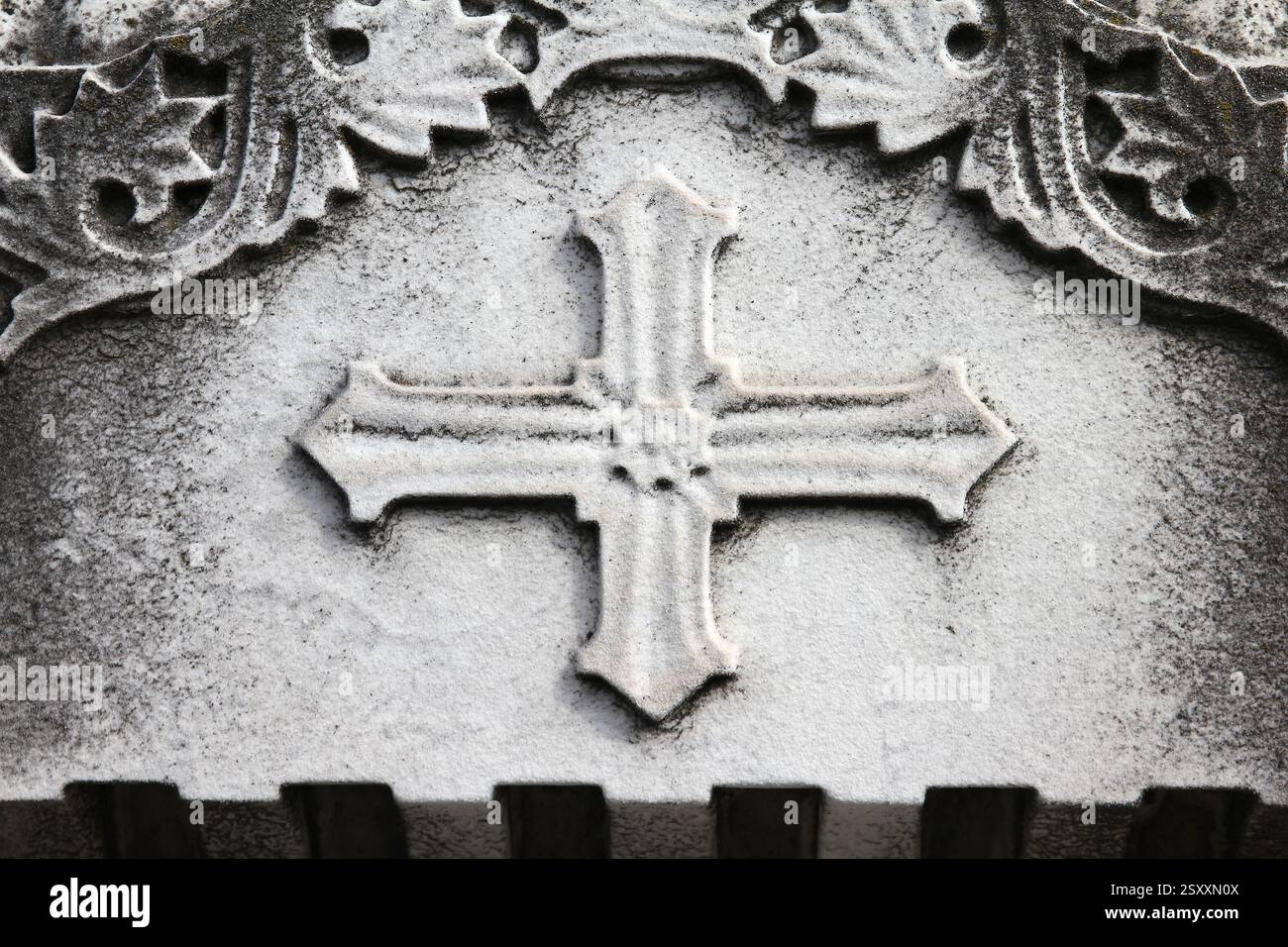 Milan, Italy. Cross engraving stonework on a grave in Monumental ...