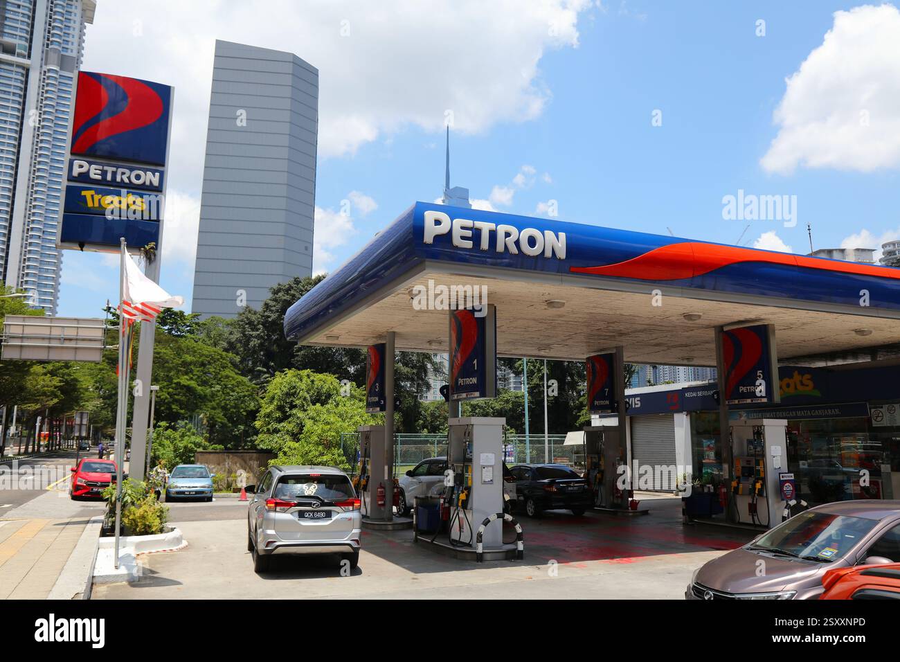 KUALA LUMPUR, MALAYSIA - MARCH 17, 2024: Drivers visit Petron brand gas ...