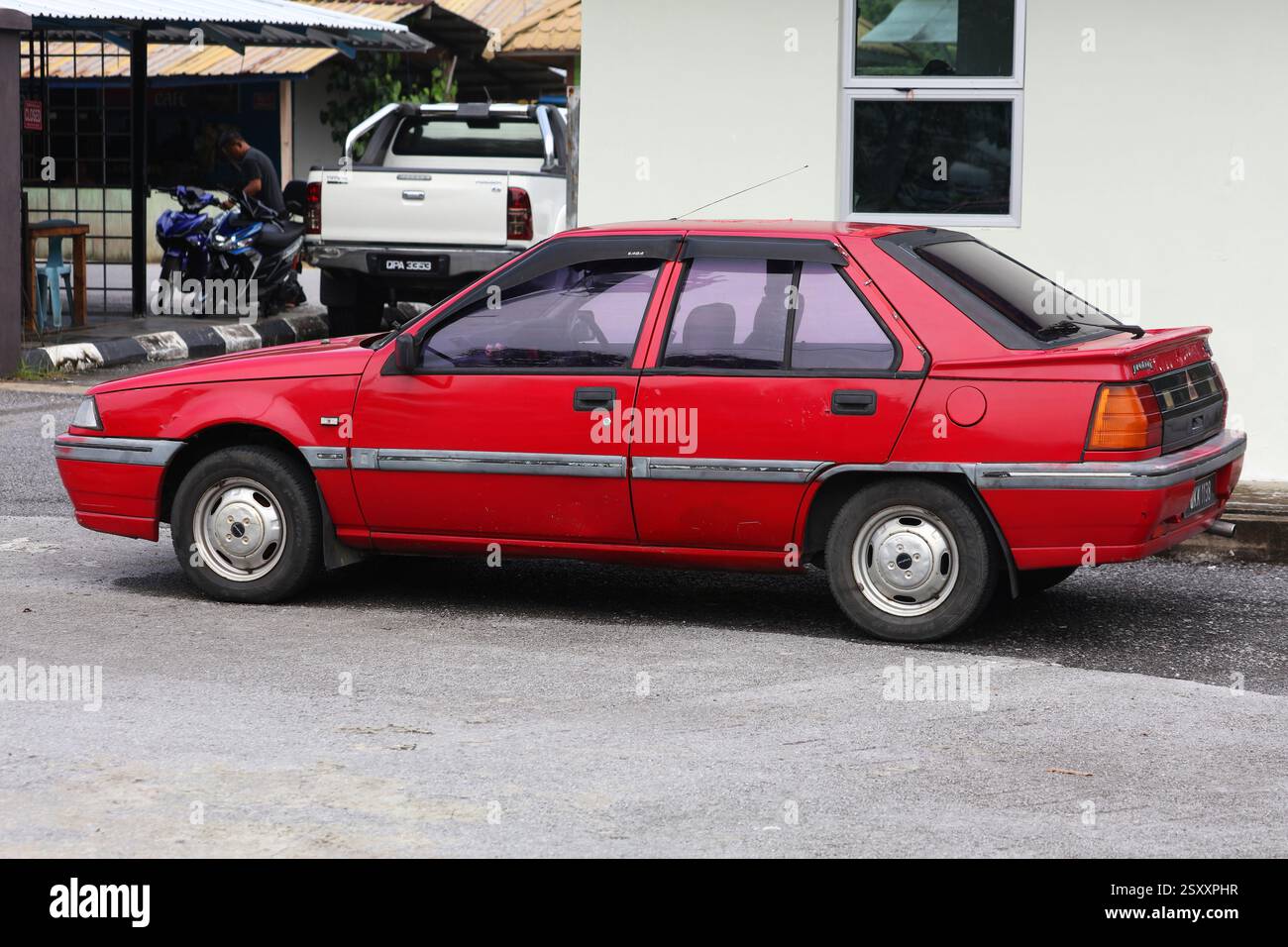 KUCHING, MALAYSIA - MARCH 9, 2024: Proton Saga Iswara Aeroback car ...