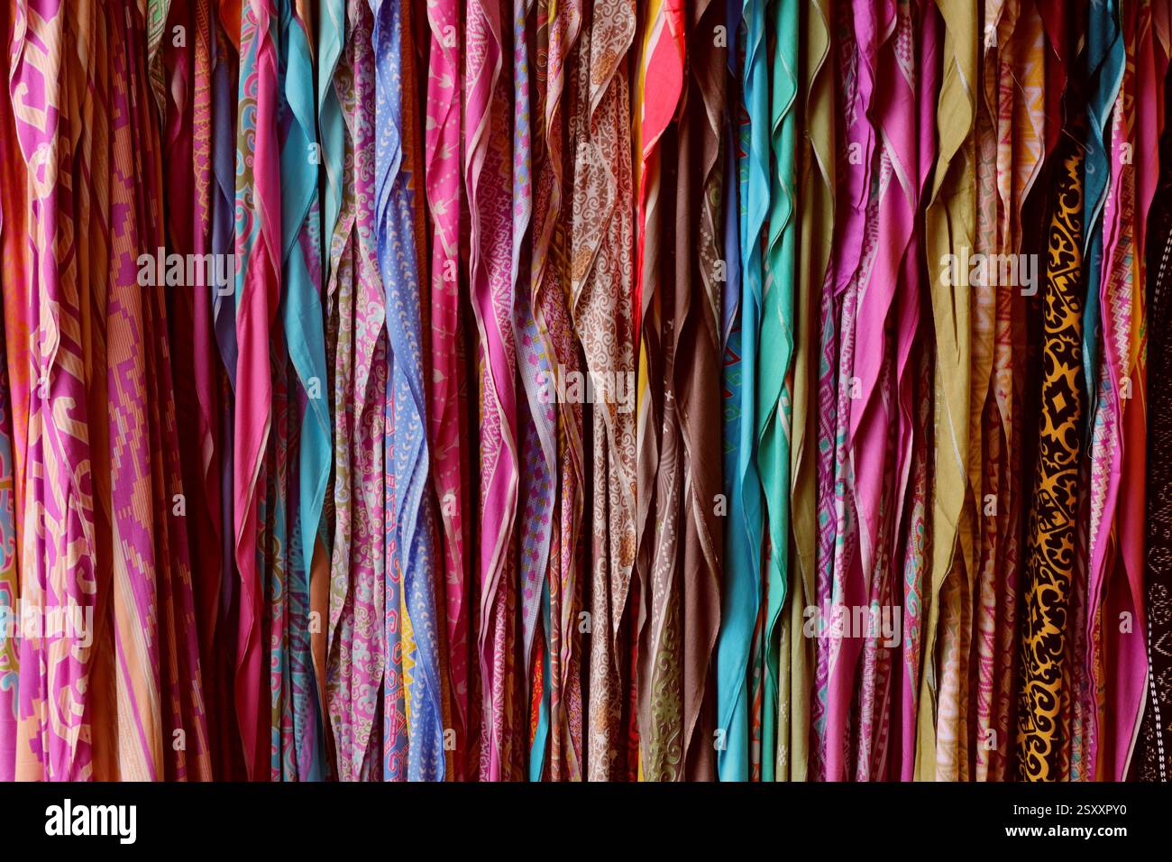 Malaysian style clothes in Kuching, Malaysia. Textile market colorful ...