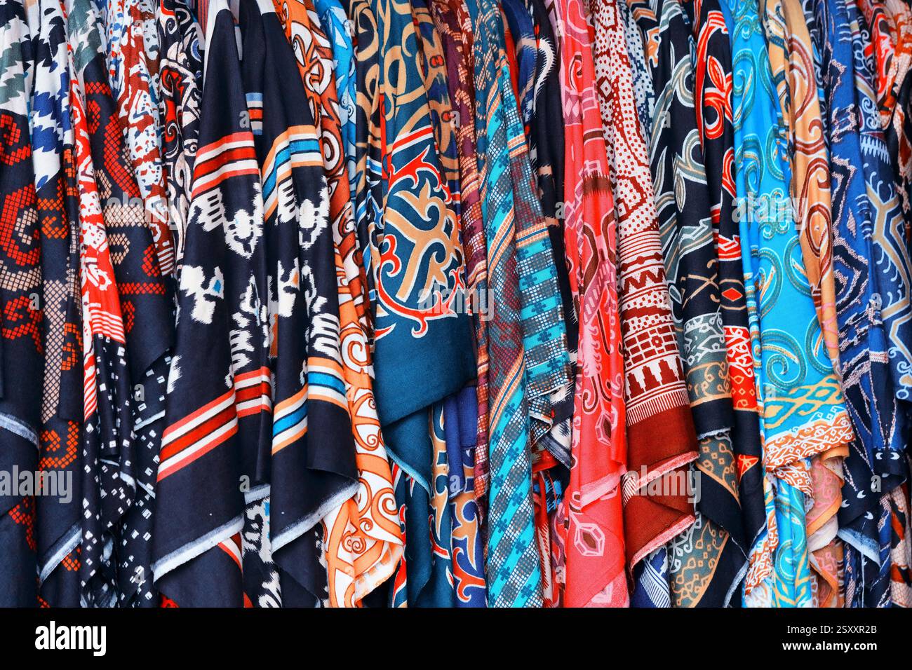 Malaysian style clothes in Kuching, Malaysia. Textile market colorful ...