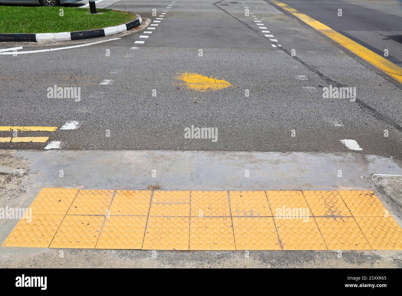 Tactile paving (tenji blocks) by the pedestrian crossing in Singapore ...