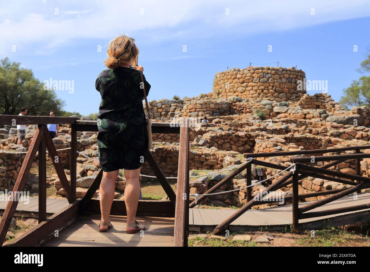 SARDINIA, ITALY - MAY 25, 2023: Tourist takes photos of Nuraghe La ...