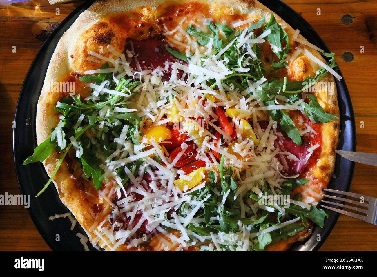 Italian pizza freshly served in a restaurant in Sardinia island in ...