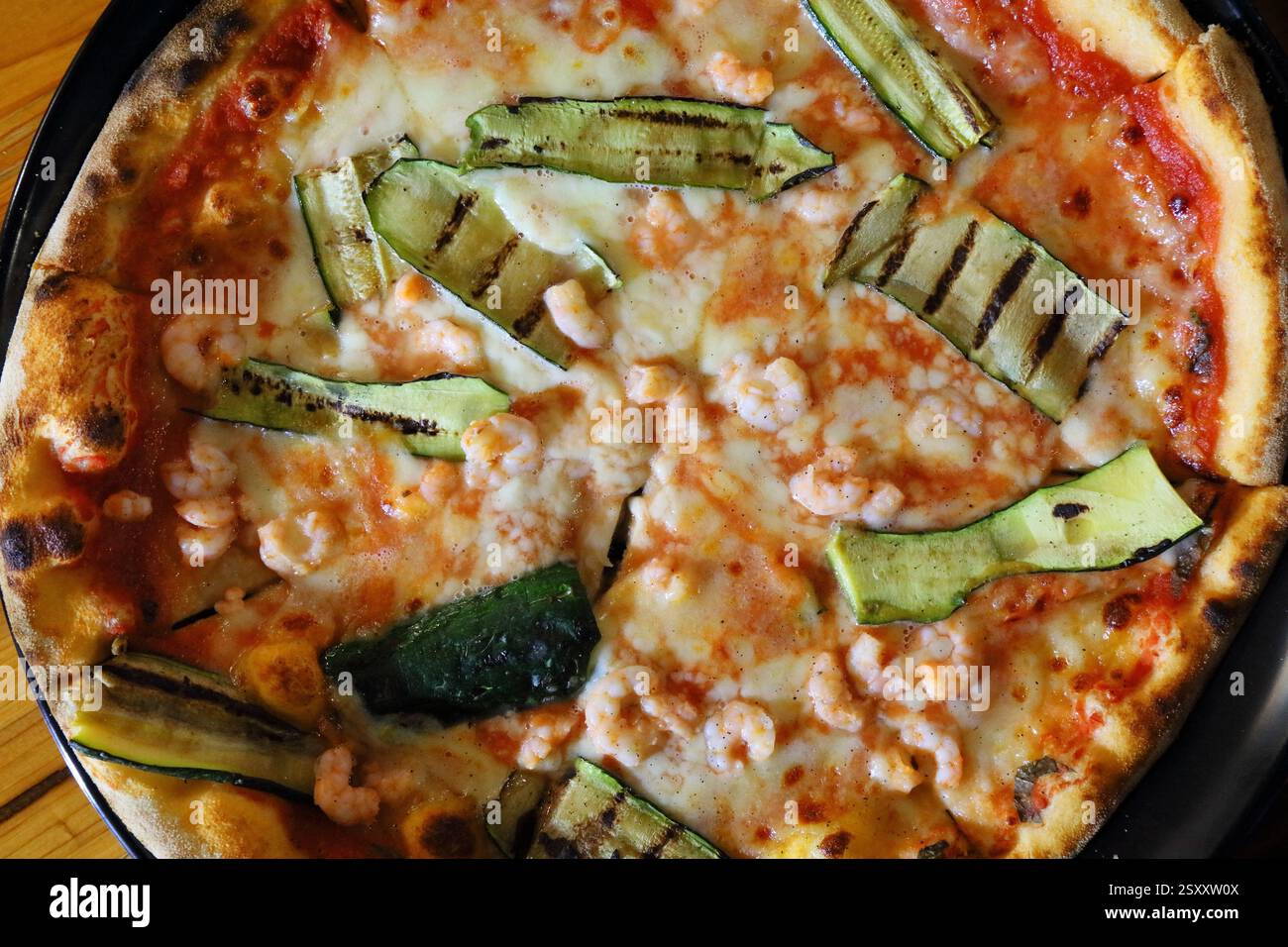Italian pizza freshly served in a restaurant in Sardinia island in ...