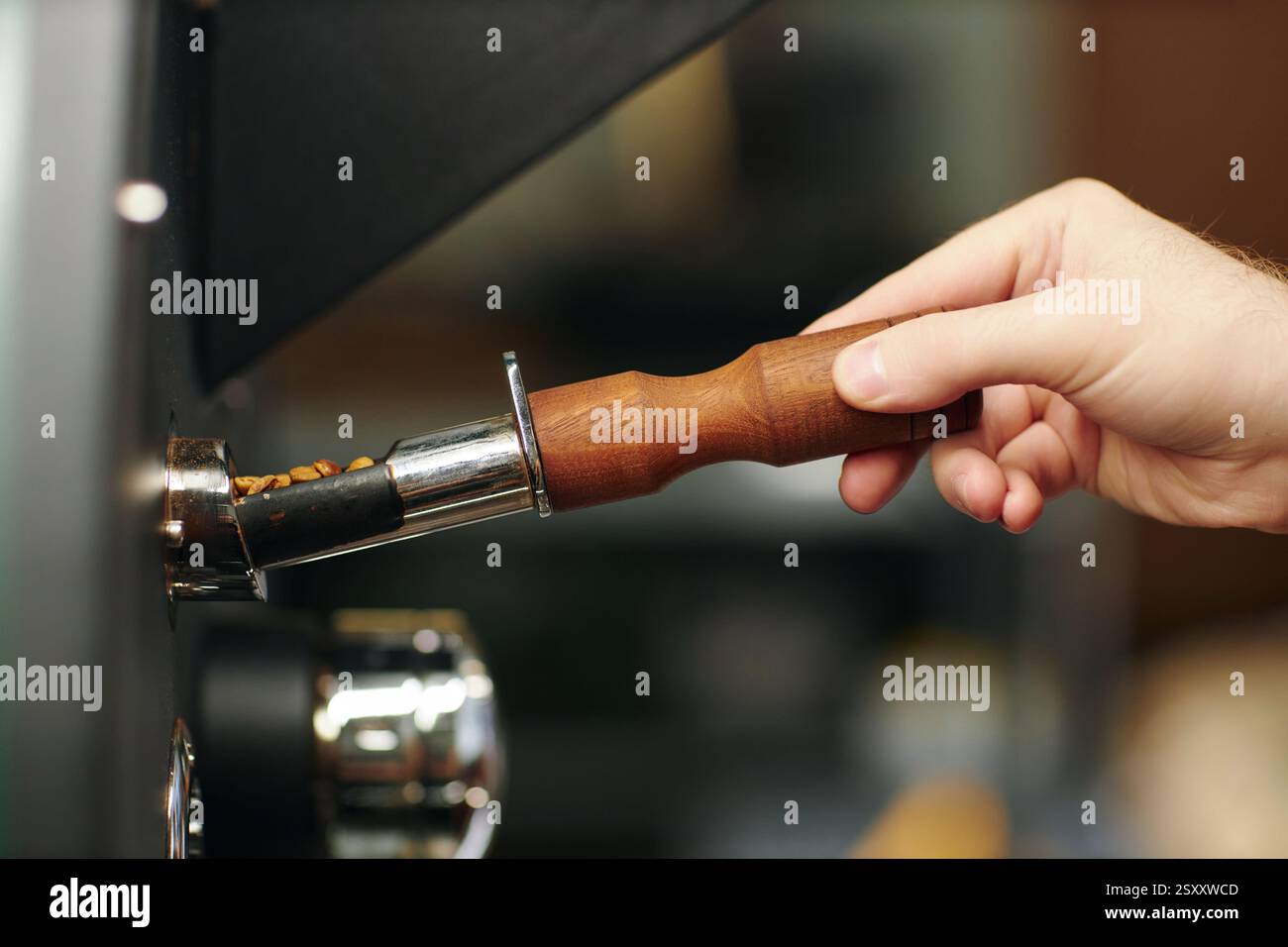 Medium close up of unrecognizable male hand holding small metal scoop ...