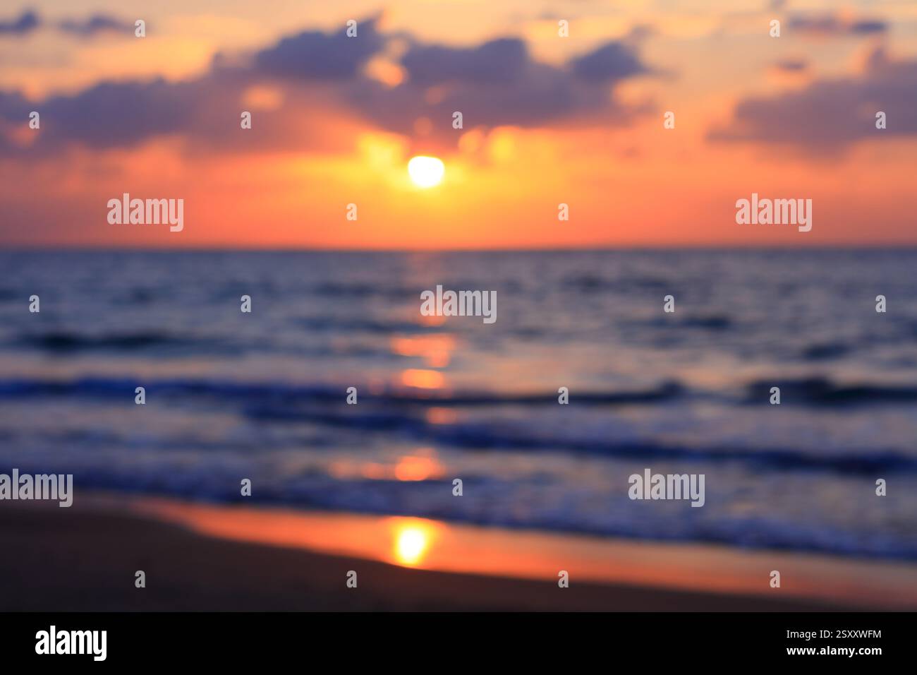 Defocused sea sunset background. Blurry view of sunset over ...