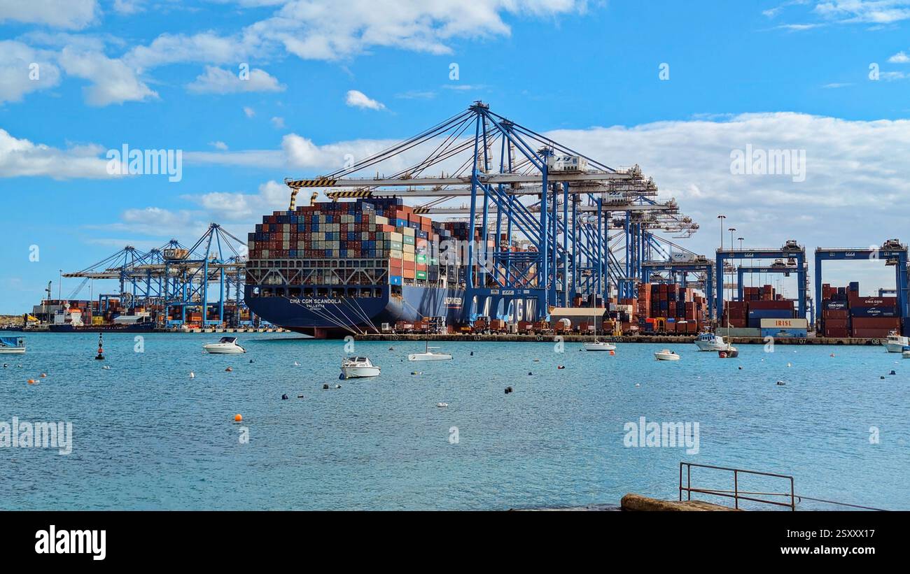Huge container vessels line pier, container flow fueling commerce ...