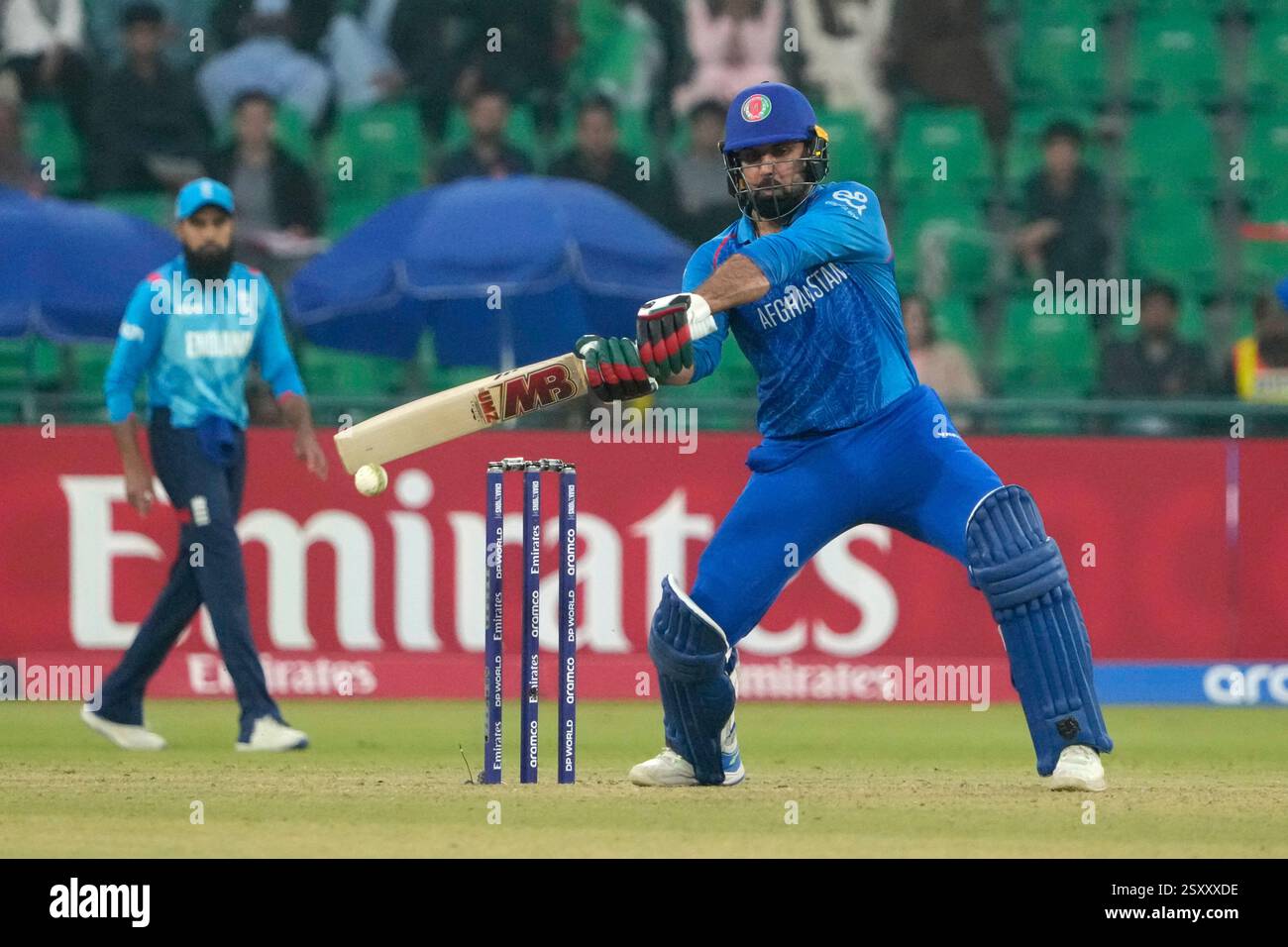 Afghanistan's Mohammad Nabi plays a shot during the ICC Champions ...