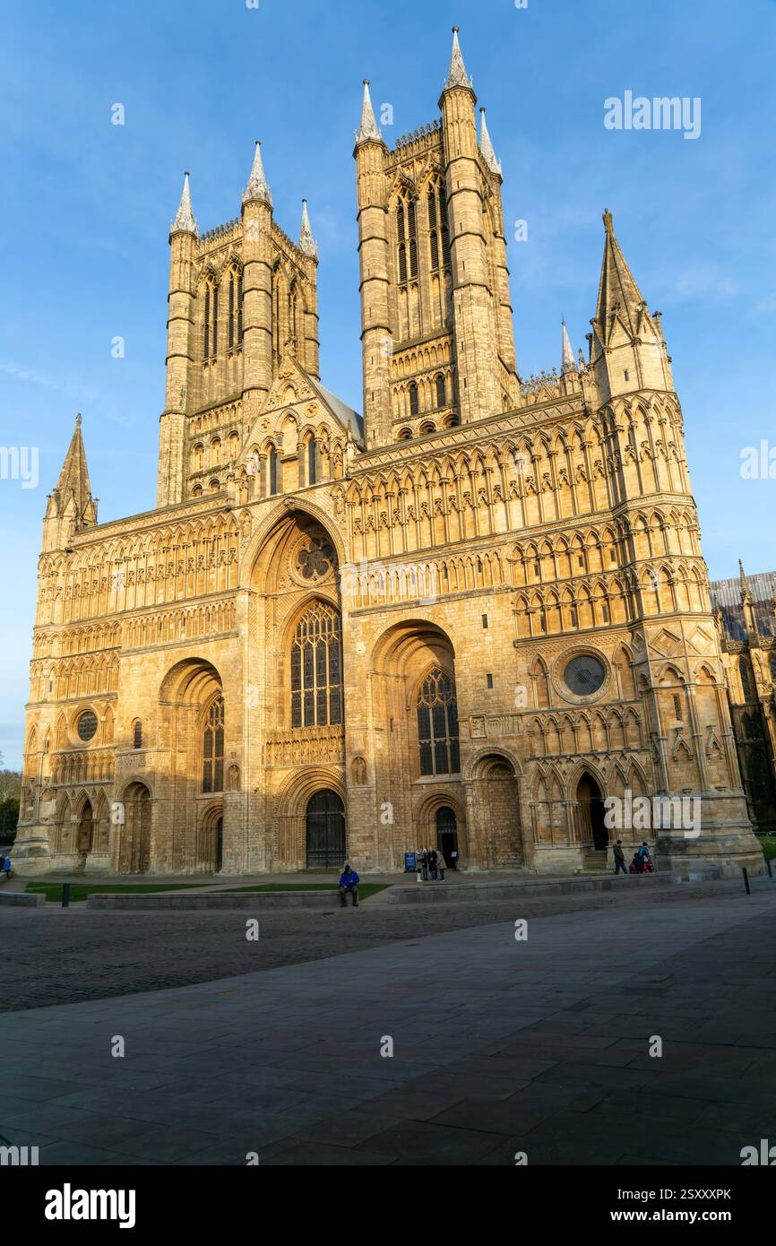 West frontage of cathedral church in evening light, Lincoln ...