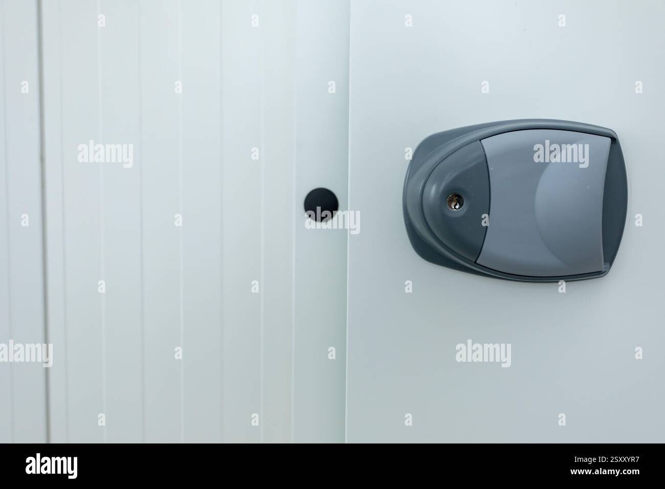 A Modern Lock Installed on a Minimalistic White Door That Enhances ...