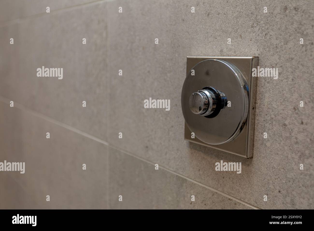 A Modern Shower Control Valve on a Textured Wall enhances both ...