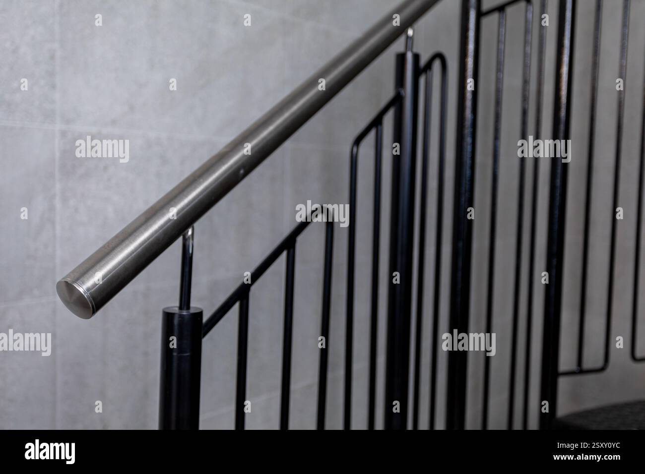 A modern staircase with a stylish handrail that enhances aesthetics ...