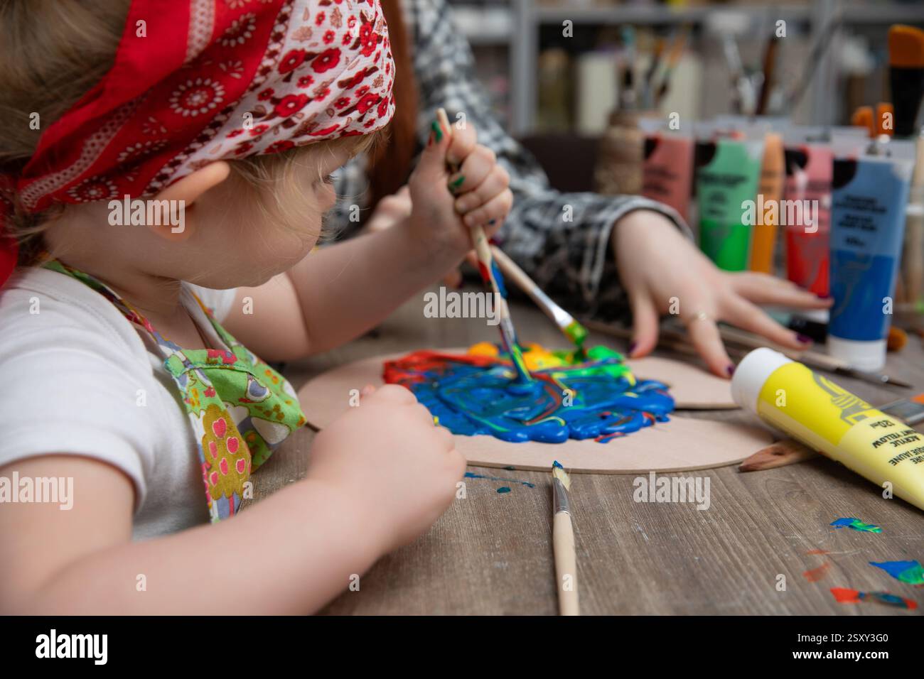 Engaging child painting process in art studio using various techniques ...