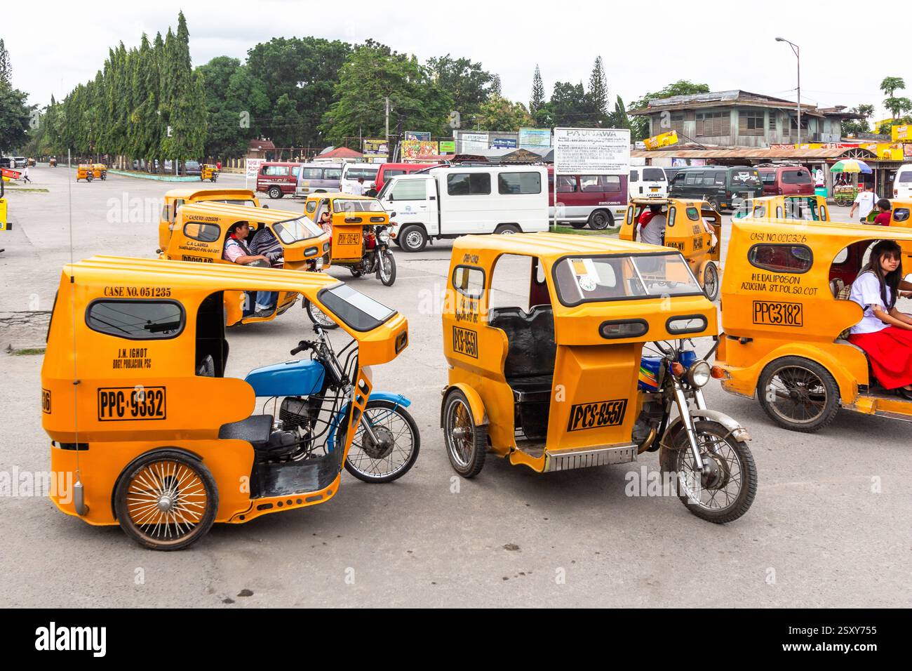 Yellow tricycles at a transport terminal in South Cotabato, Philippines ...