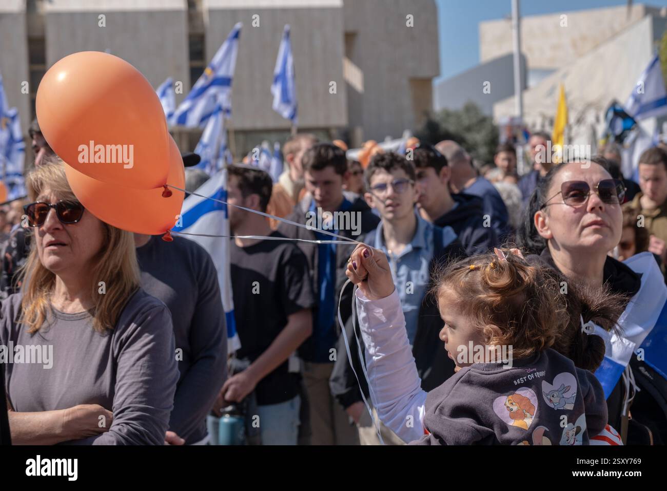 Tel Aviv, Tel Aviv, Israel. 26th Feb, 2025. People react as they watch ...