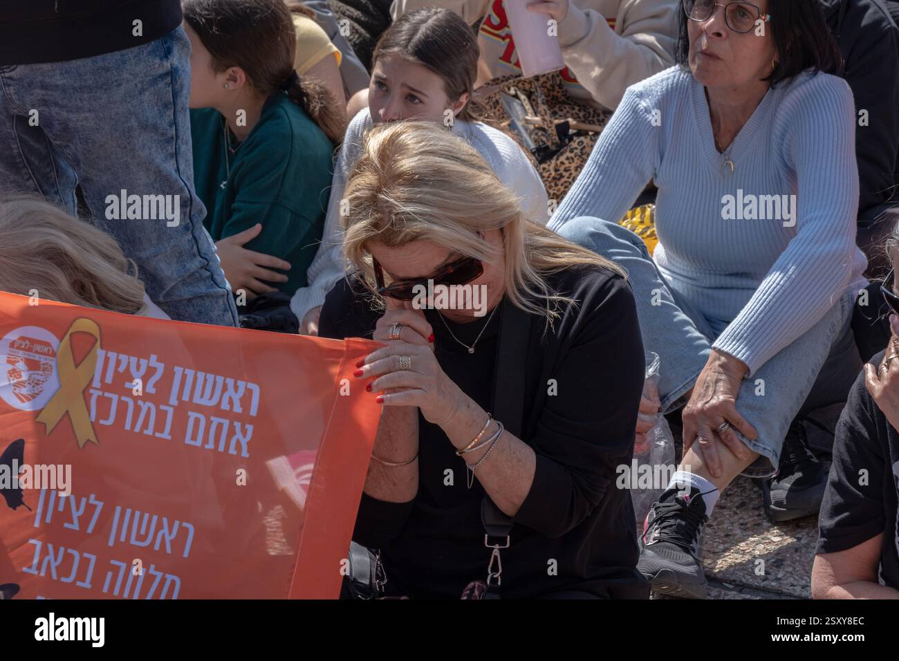 February 26, 2025, Tel Aviv, Tel Aviv, Israel: People react as they ...