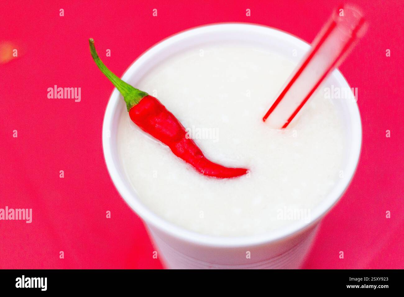 A local shake dessert topped with red chili, a popular spicy treat that ...