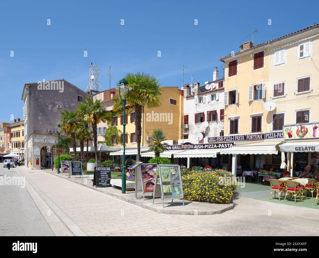 Tourist destination Rovinj, street view of a restaurants along the ...