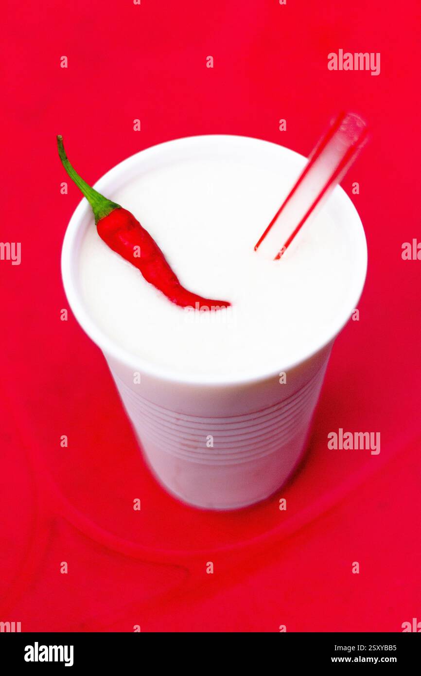 A local shake dessert topped with red chili, a popular spicy treat that ...