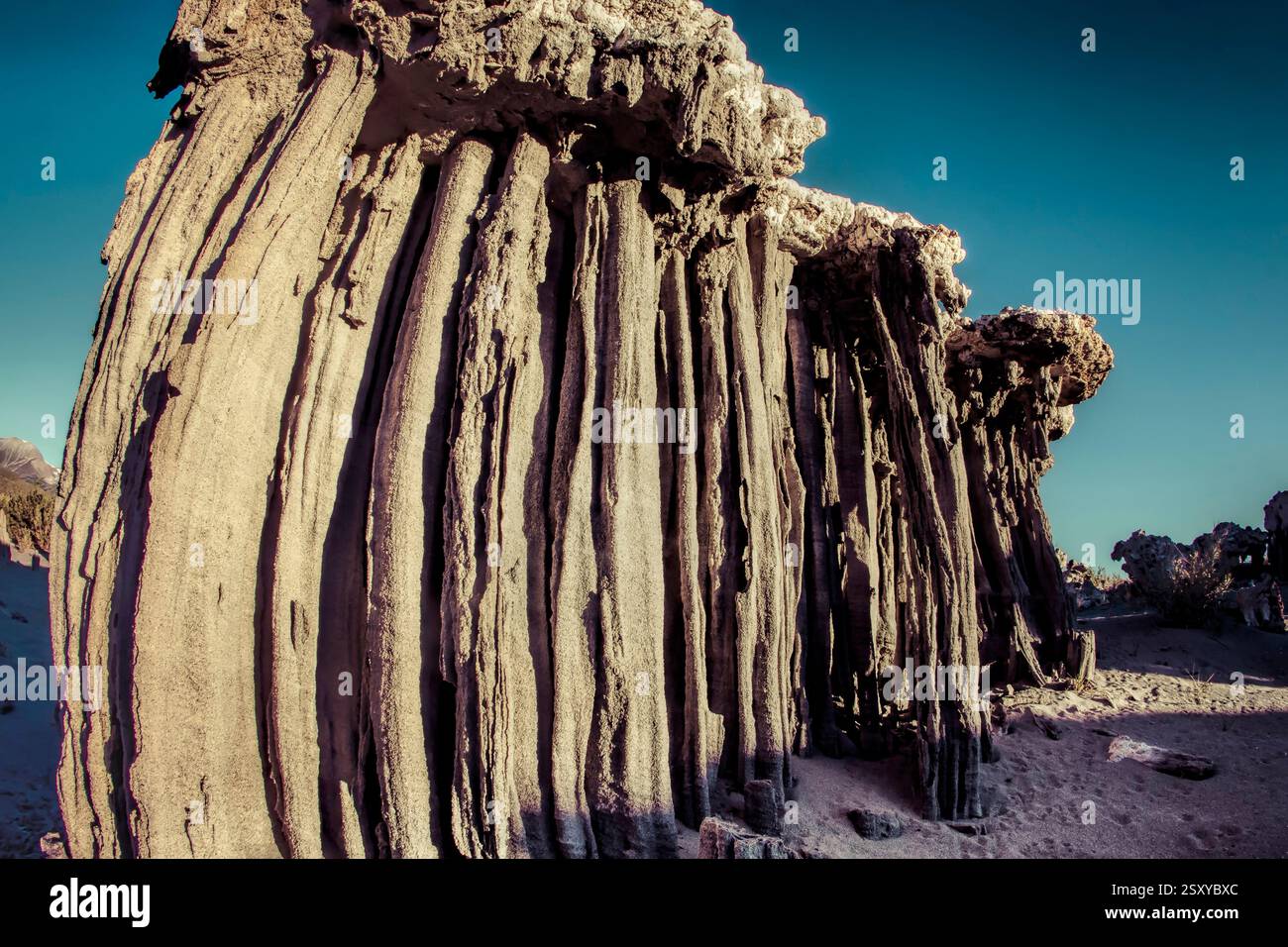 Large rock formation with a lot of cracks and crevices. The rock is ...