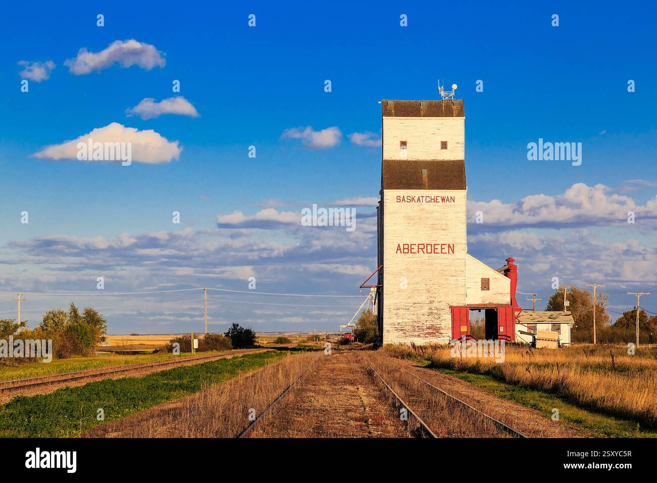 Grain silo with the words "Artisan" on the side. The silo is white and ...