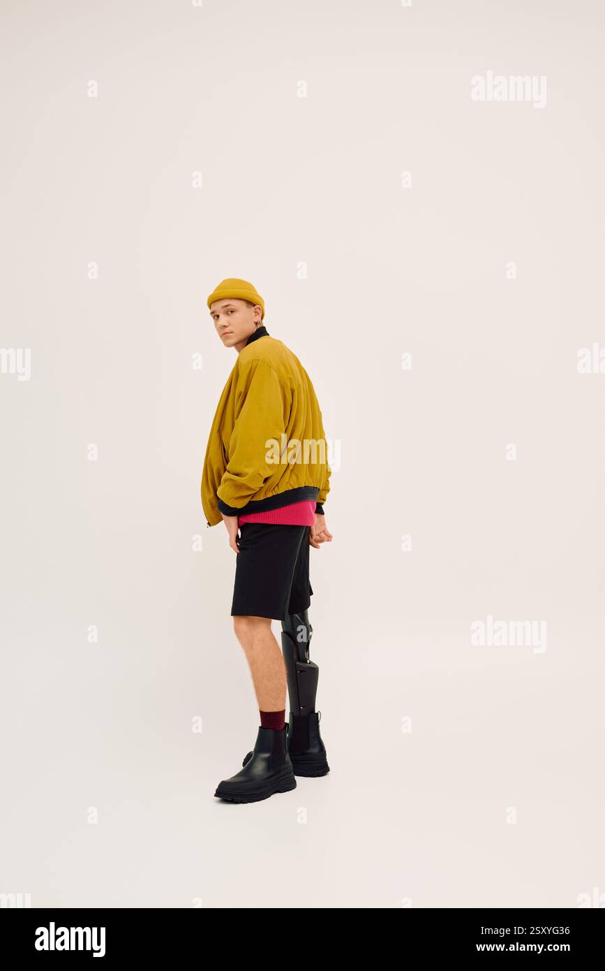 A young man with a prosthetic leg models trendy attire, embodying style ...