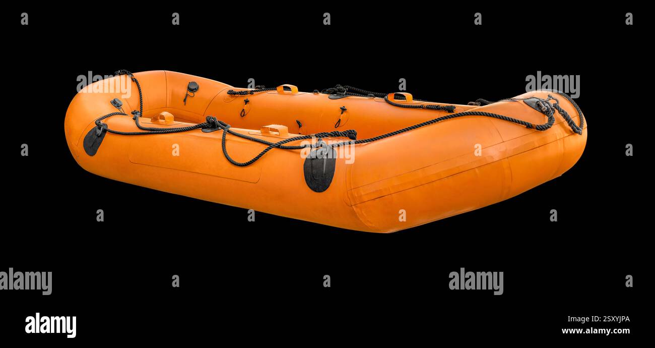 Orange rubber boat isolated in black back Stock Photo - Alamy