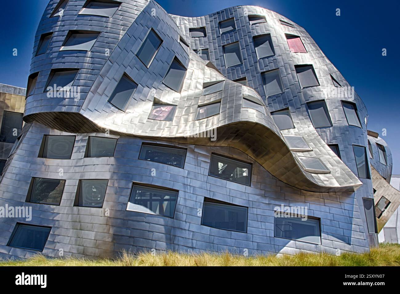 Building with a lot of windows and a curved roof. The building is ...