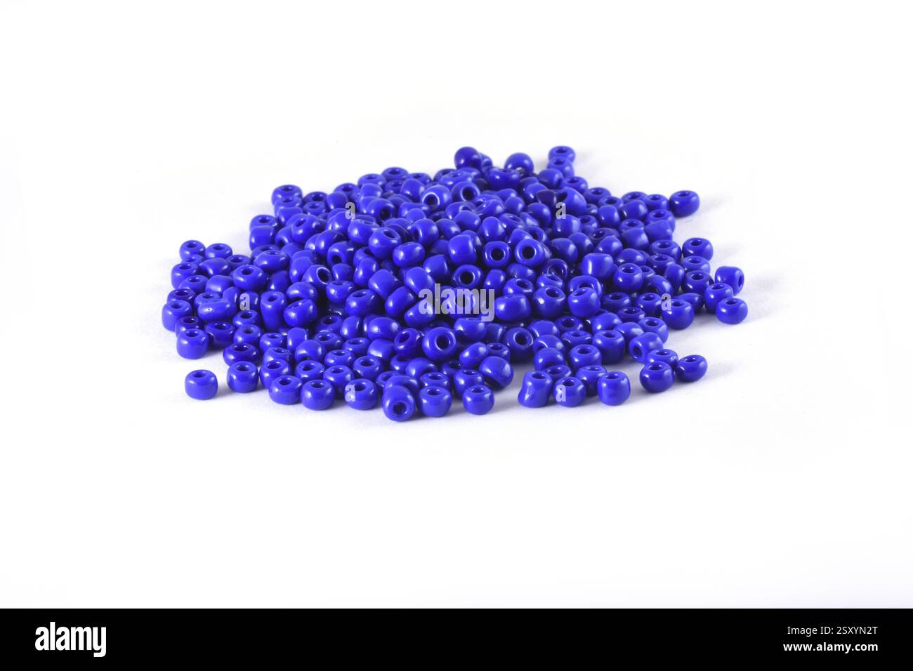 Beads spread on white background. Background or texture of beads. Close ...