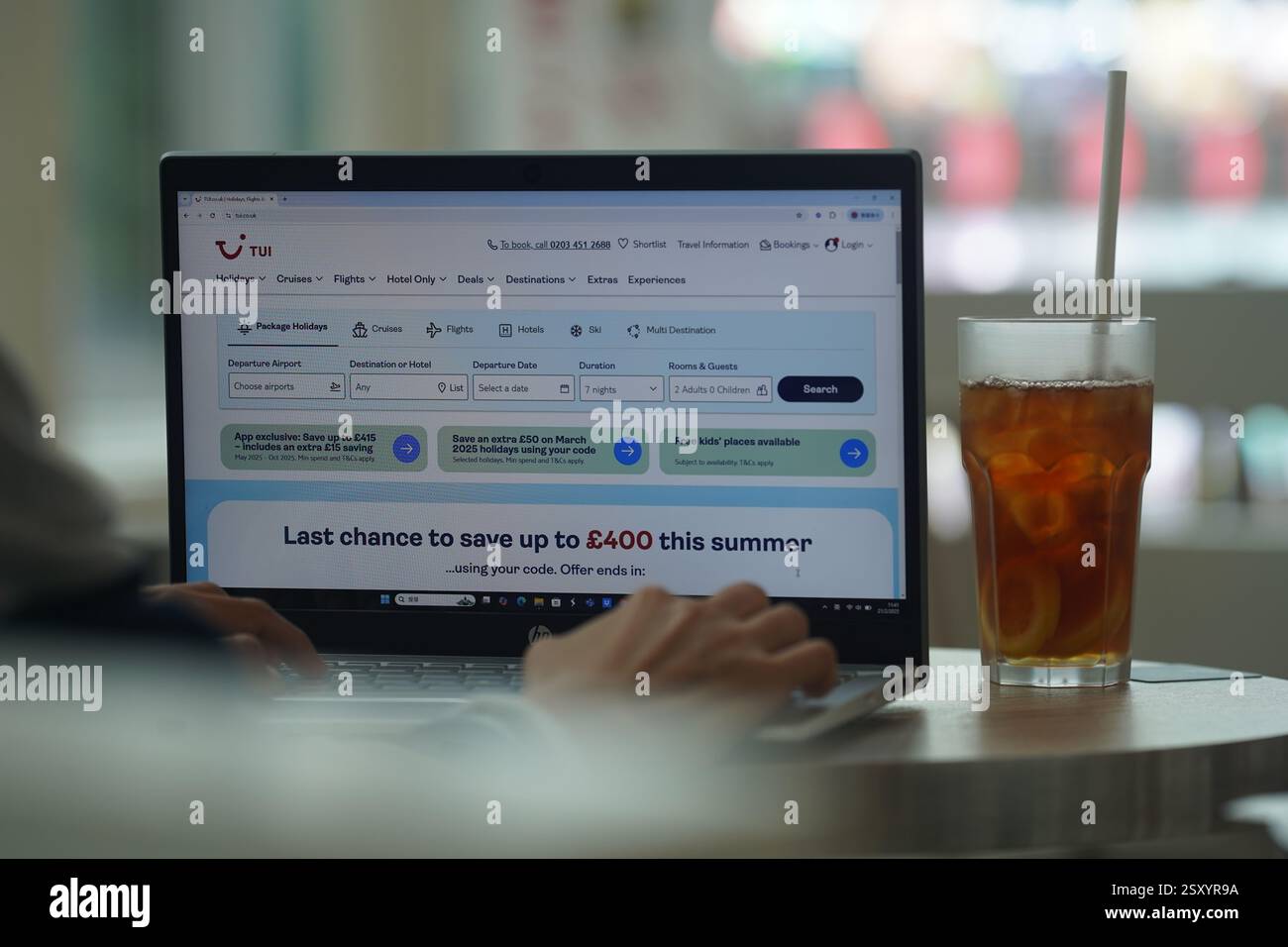 In this photo illustration, A woman browses TUI Airways website on her ...