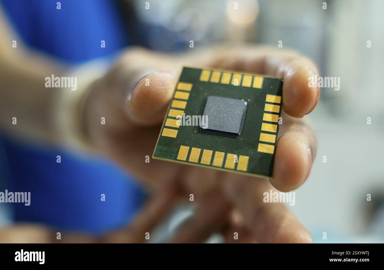 A person shows a computer chip in a stall, during The Advantage Assam 2 ...