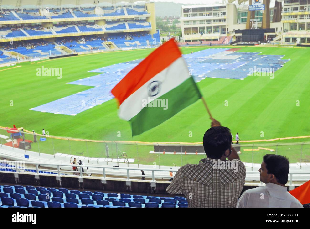 Cricket fans wave Indian flag at D Y Patil cricket stadium, Nerul, Navi ...