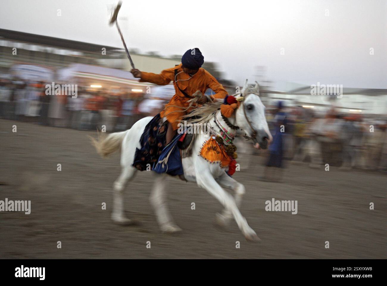 Nihang sikh warrior performing stunts in celebrations of consecration ...