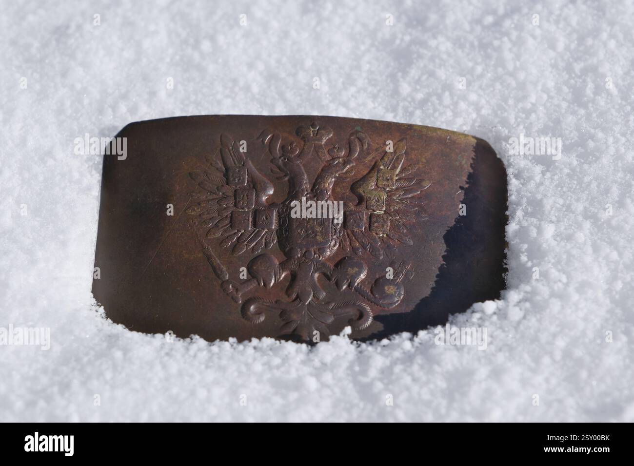 Close up of a belt buckle of the Russian Imperial Army on the snow in ...