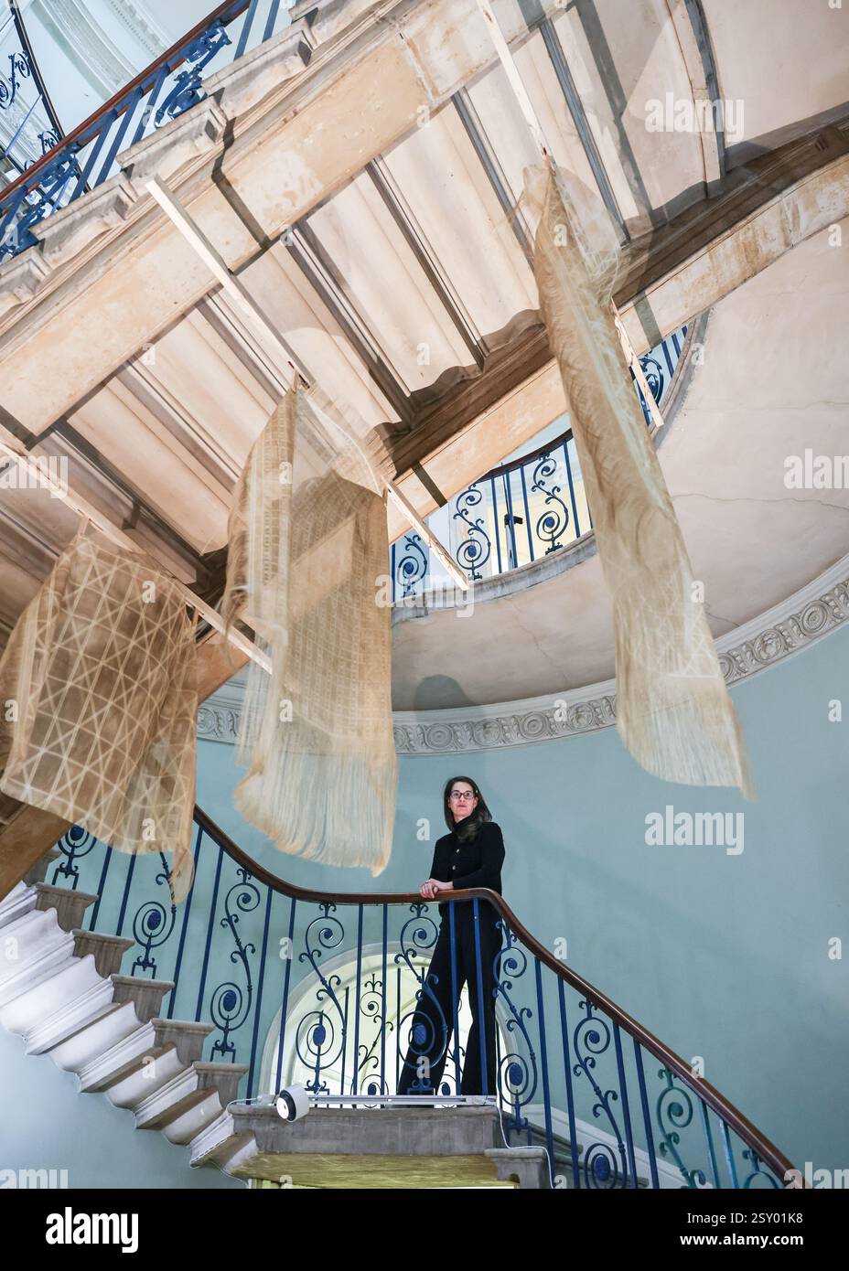 London, UK. 26th Feb, 2025. Staff pose with 'In the Drift of Paper' by ...