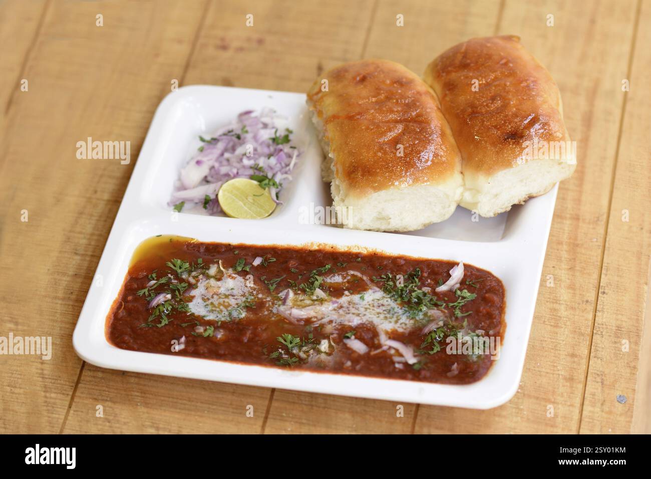 Indian delicious Pav Bhaji with onion and coriander spread on top of ...