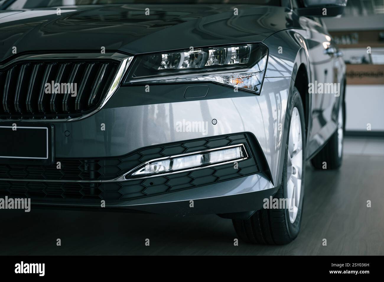 Close up view of front part of modern black automobile in car ...