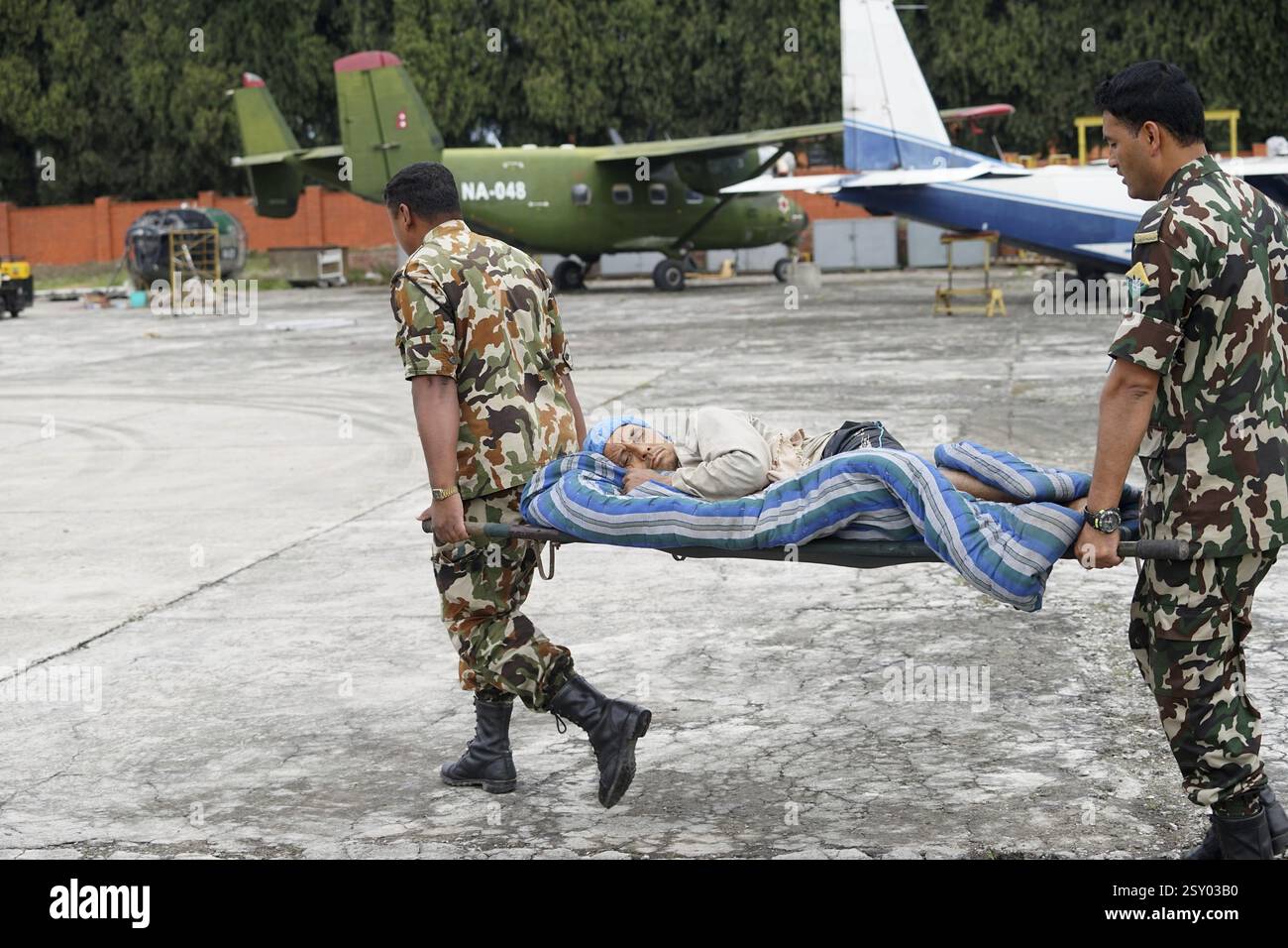 Army personnel carry injured person stretcher, earthquake, nepal, asia ...