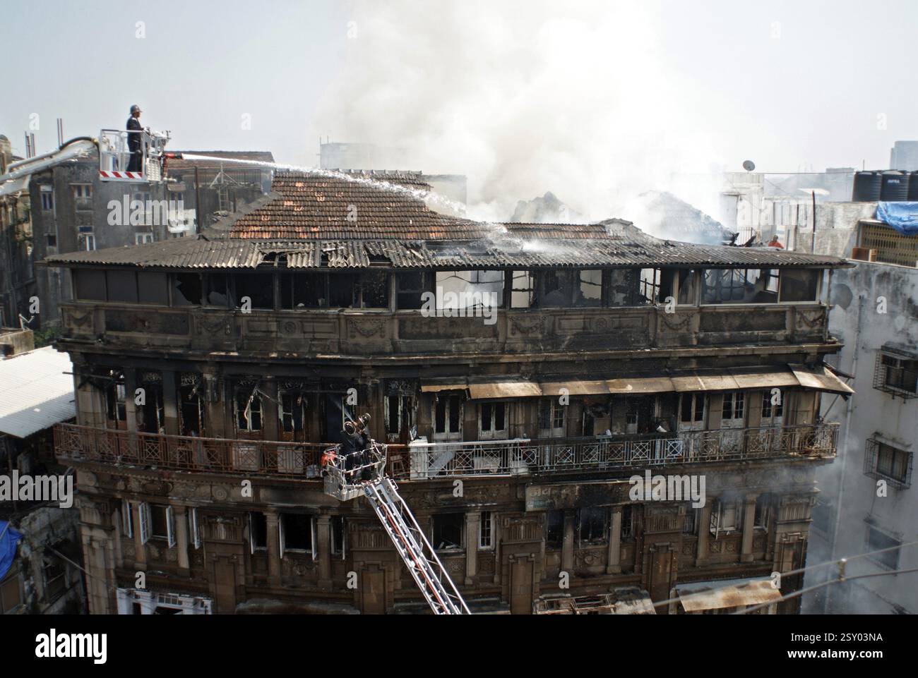 Firemen dousing fire in johri mansion at Kalbadevi, Bombay Mumbai ...