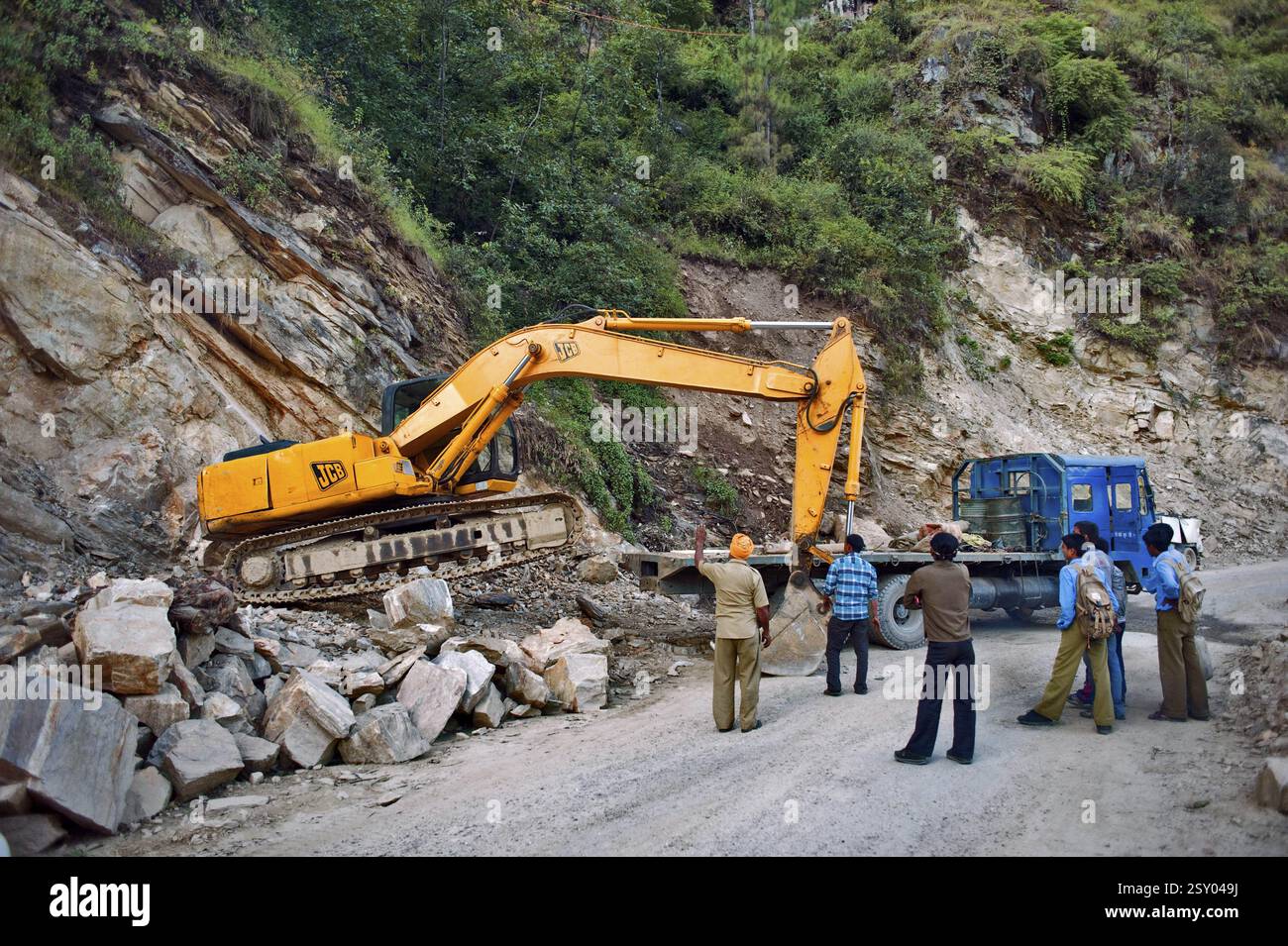 Hydraulic excavator on road, uttarakhand, india, asia Stock Photo - Alamy