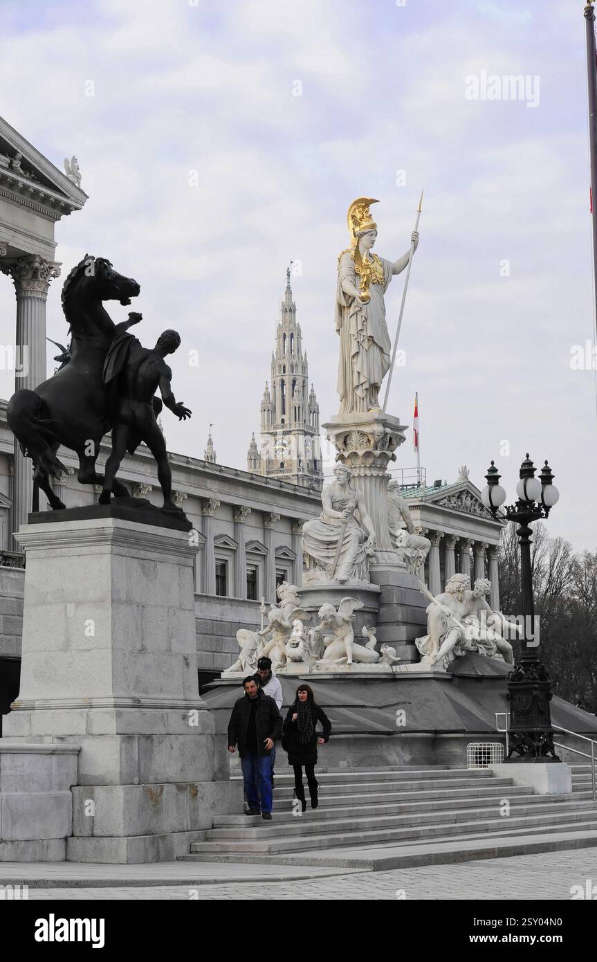 Statue of Pallas Athena in front of the Parliament, Vienna, People walk ...
